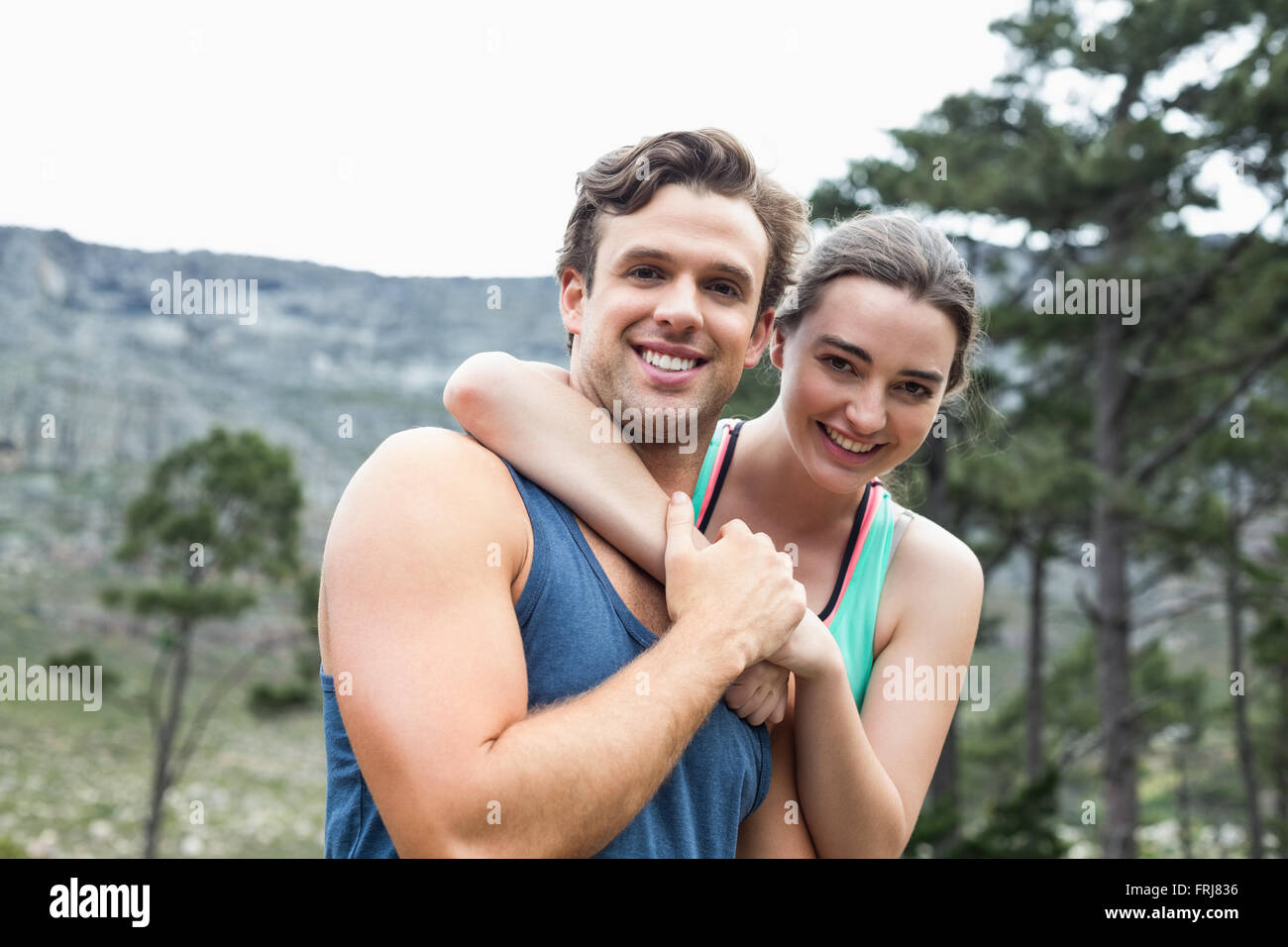 Portrait of happy woman hugging man Stock Photo - Alamy