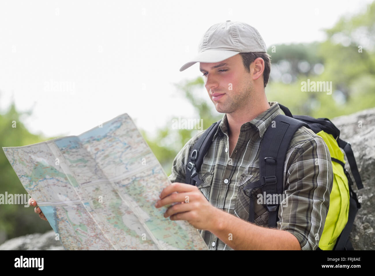 Young hiker reading map Stock Photo - Alamy