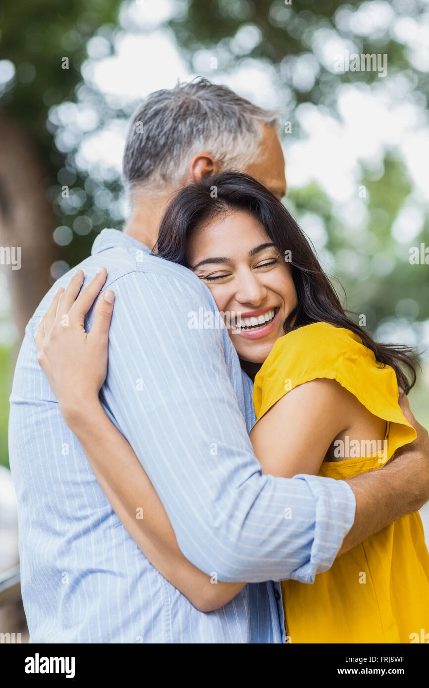 Stylish man hugging woman hi-res stock photography and images - Alamy
