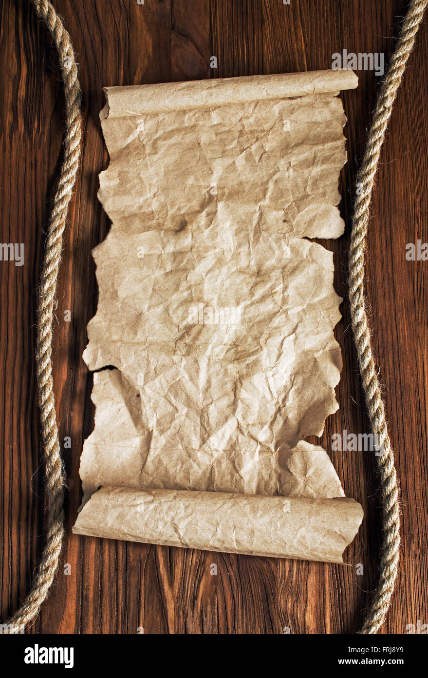 The ancient parchment or unrolled scroll on a wooden background Stock ...