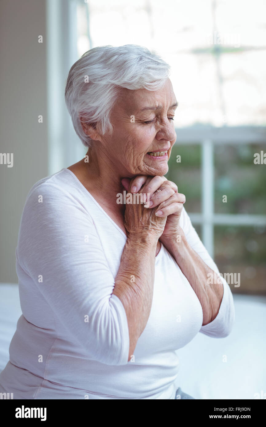 Senior citizen praying hi-res stock photography and images - Alamy