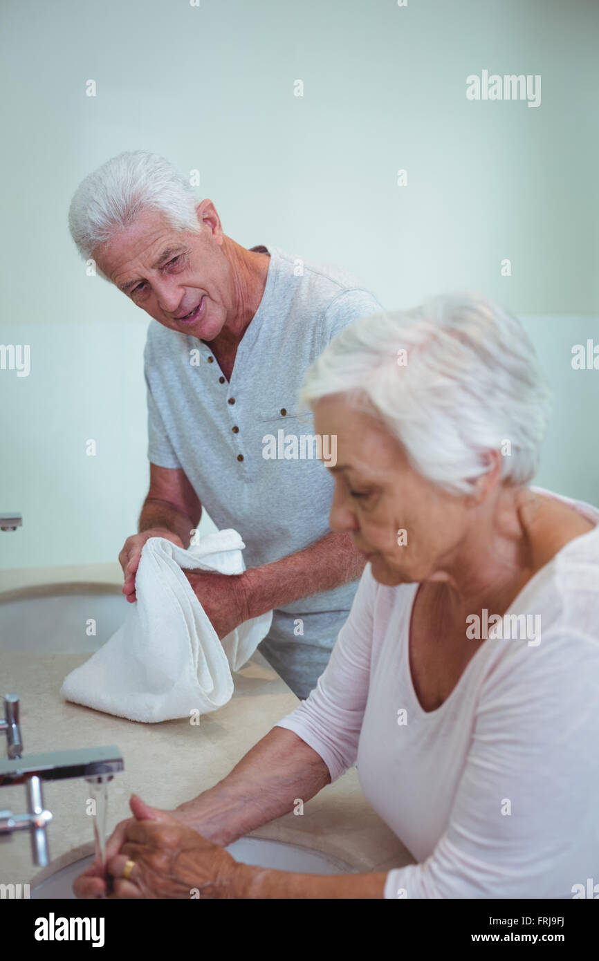 Senior couple talking in bathroom Stock Photo - Alamy