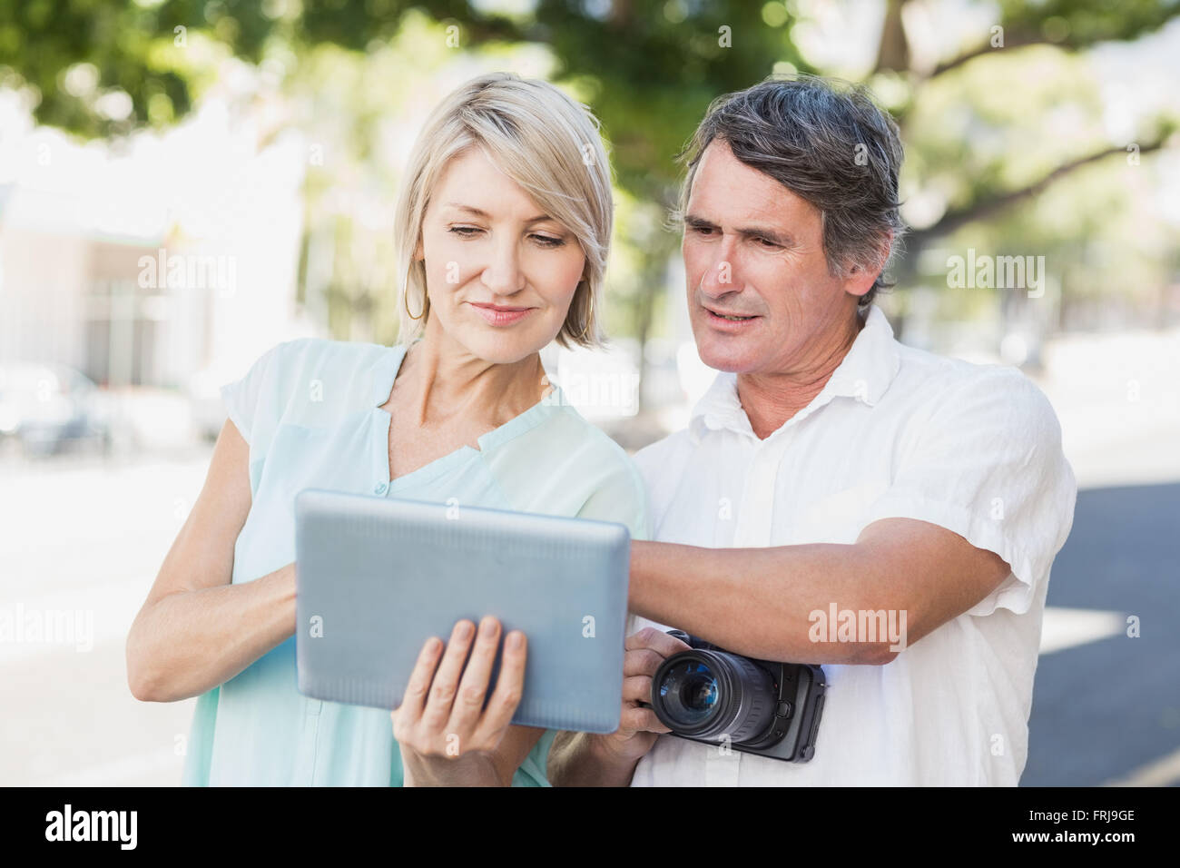 Couple using digital computer Stock Photo - Alamy