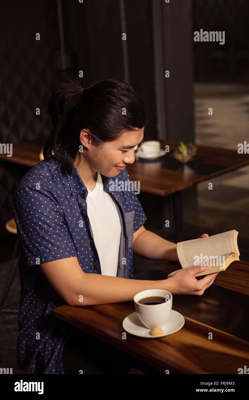 Man reading a book Stock Photo - Alamy