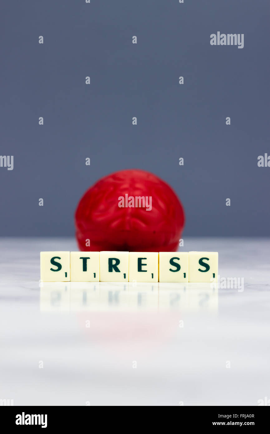 Red brain with stress sign dark background Stock Photo - Alamy