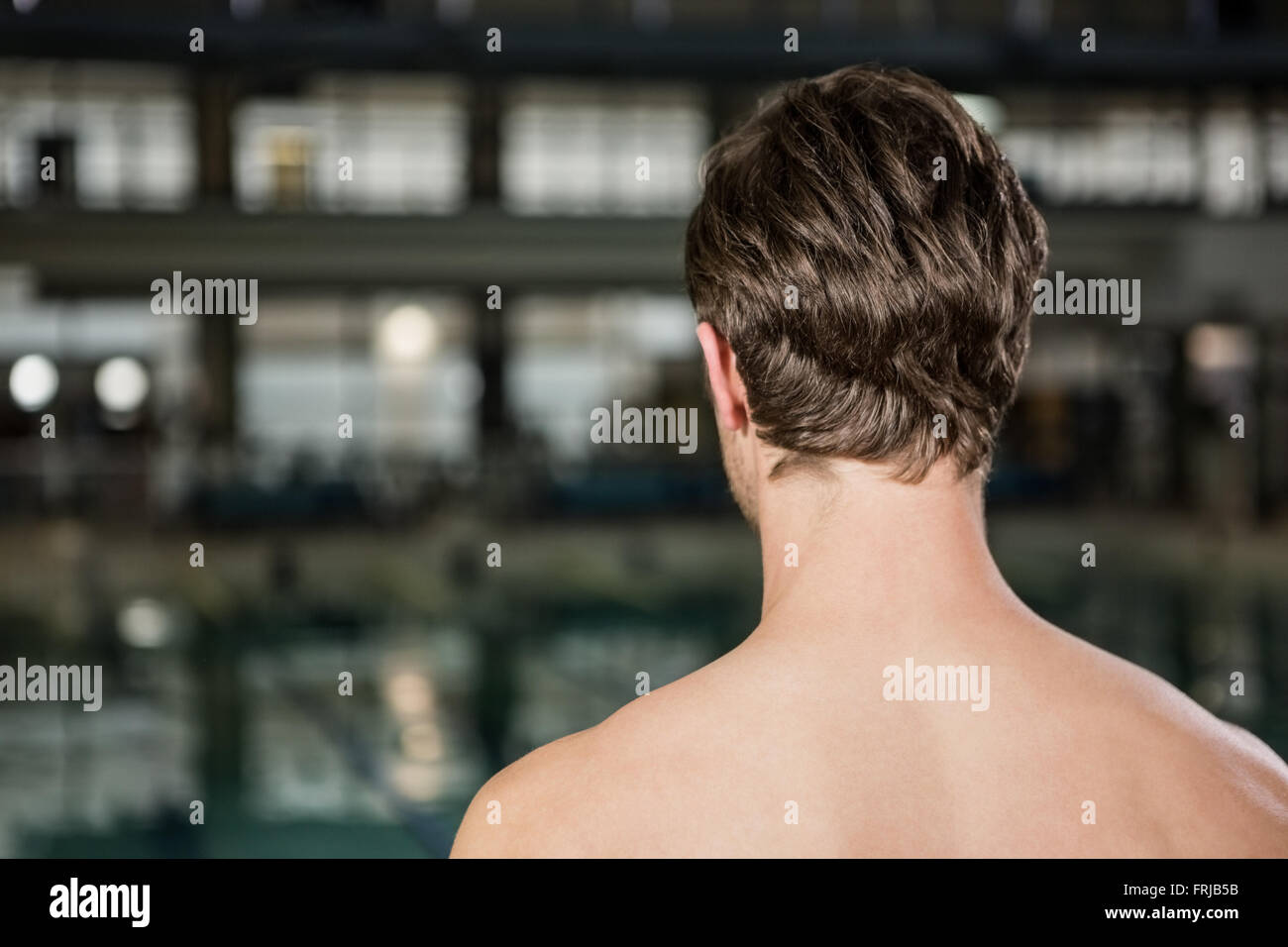 Rear view of swimmers standing by the pool Stock Photo - Alamy