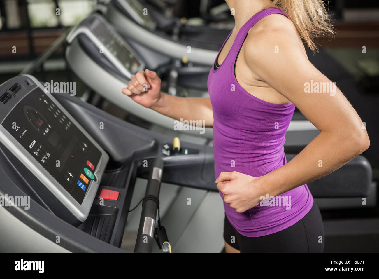 Woman walking on treadmill Stock Photo - Alamy