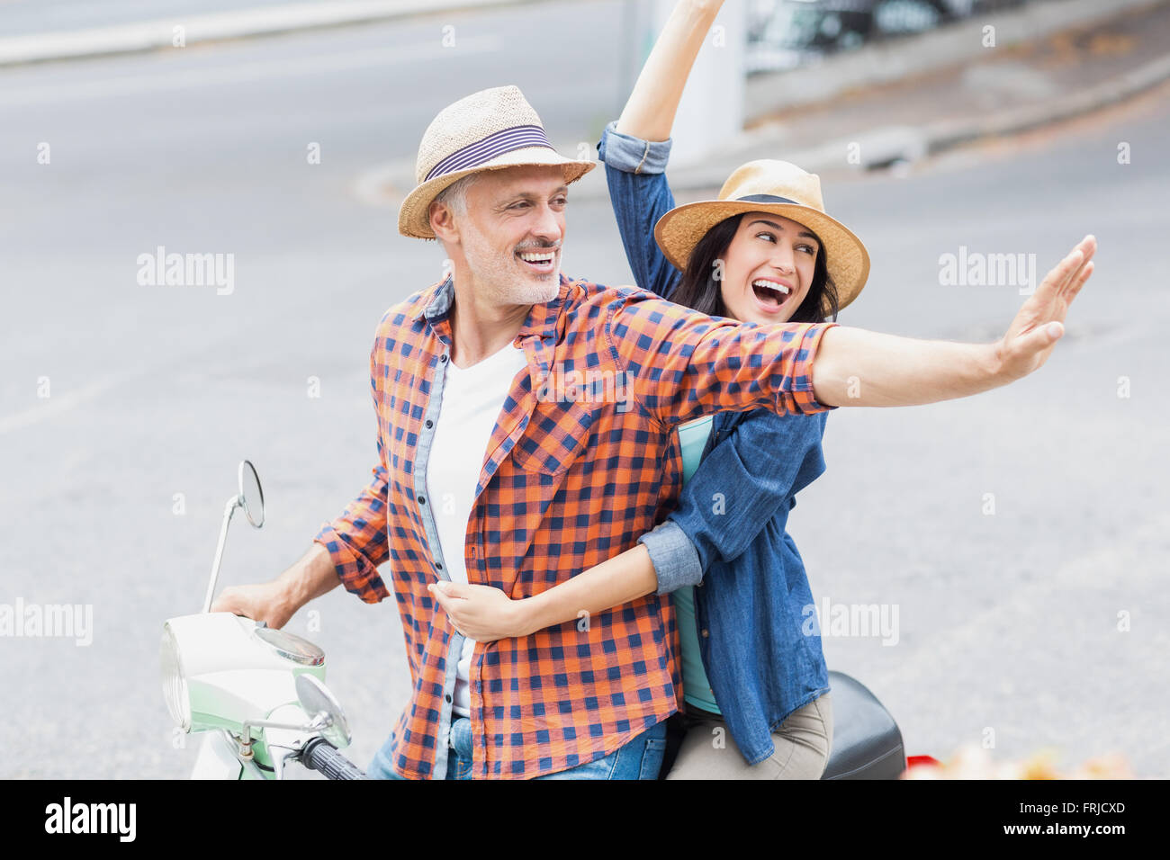 Couple of moped hi-res stock photography and images - Alamy