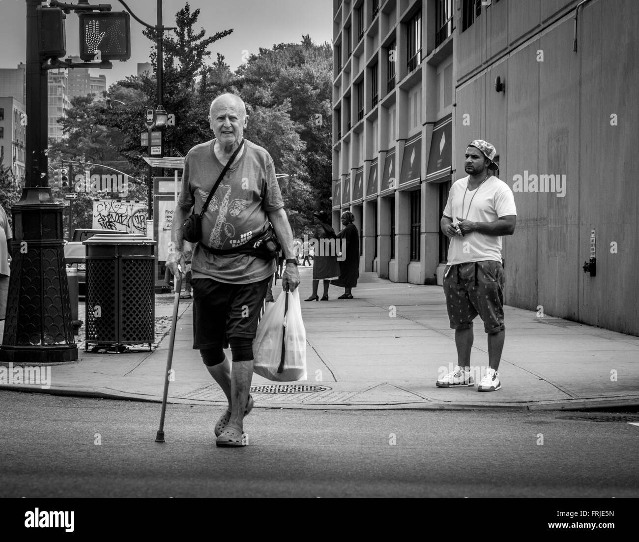 Old man crossing a road Black and White Stock Photos & Images - Alamy