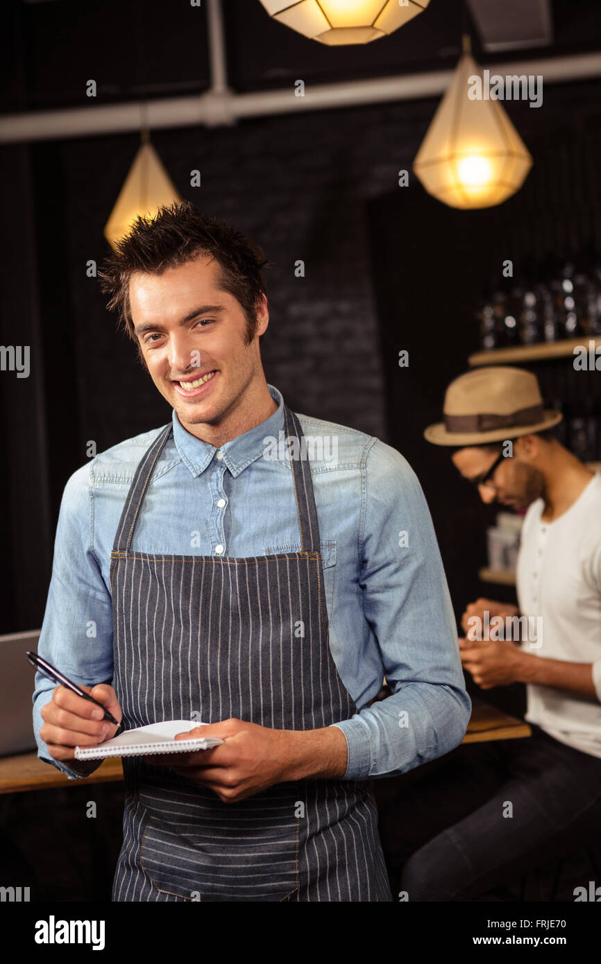 Waiter writing orders Stock Photo - Alamy