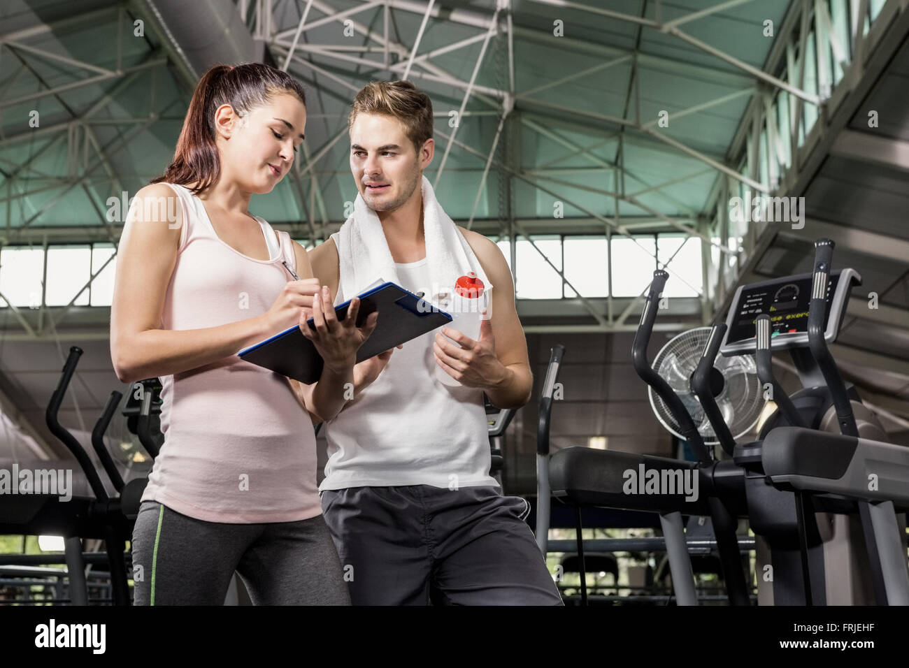 Female fitness instructor talking man hi-res stock photography and ...