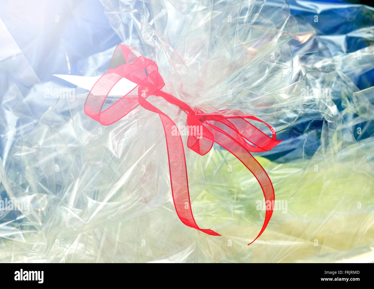 Nice red ribbon for gift wrapping in light Stock Photo - Alamy