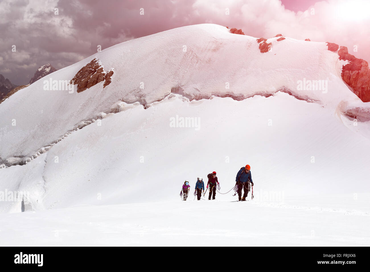 Group of Climbers Approaching to Summit Stock Photo - Alamy