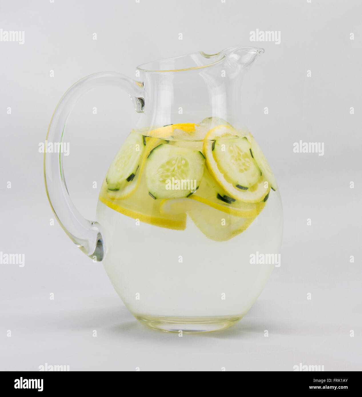 Pitcher of cucumber water against a white background Stock Photo - Alamy