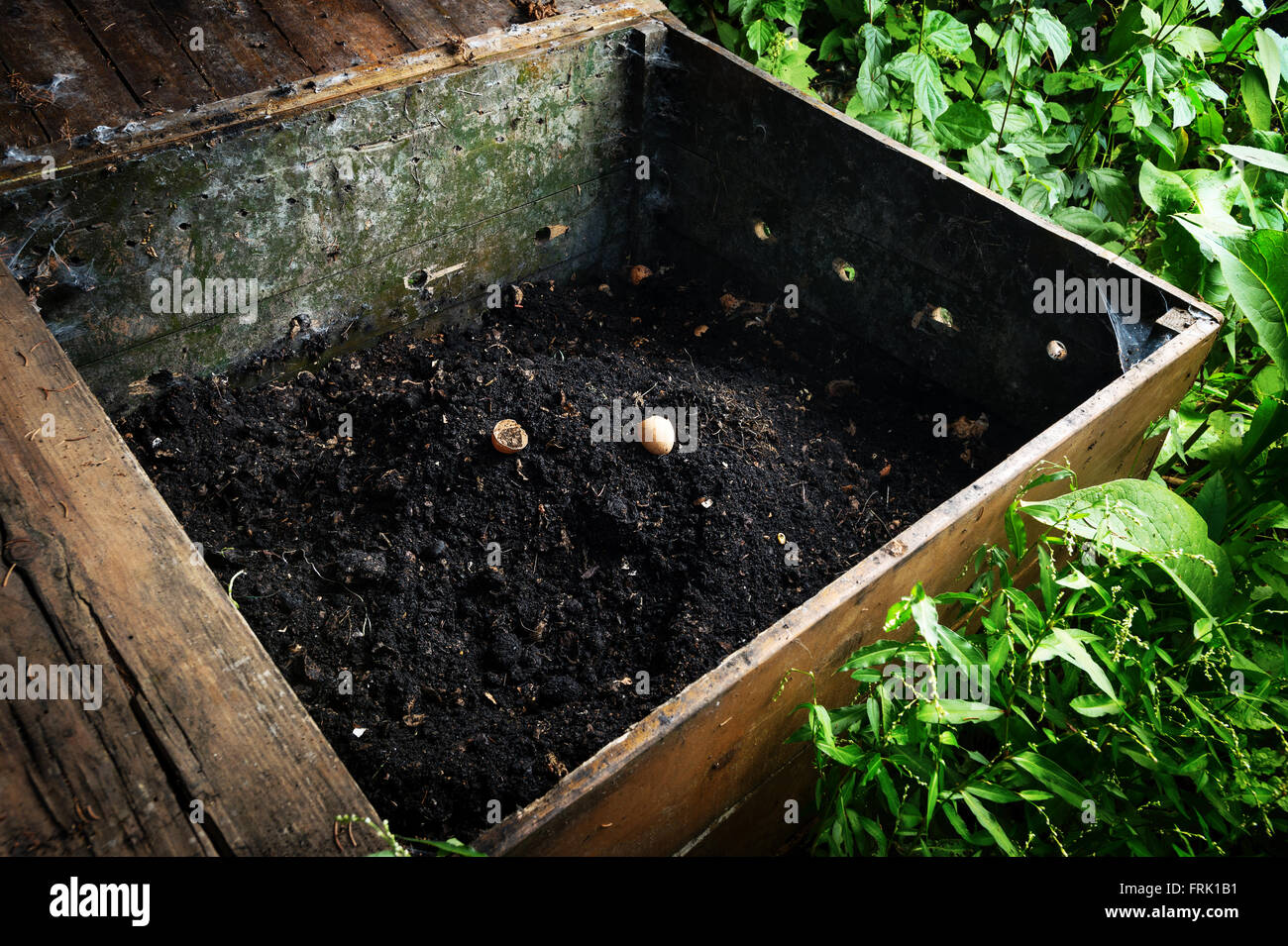 Ready made compost pile in wooden crate Stock Photo - Alamy