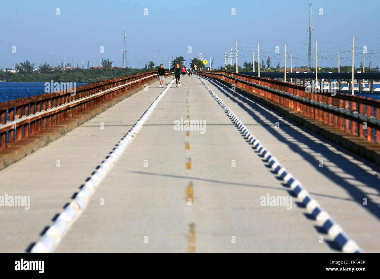 Hikers make their way along the historic Seven Mile Bridge in the ...