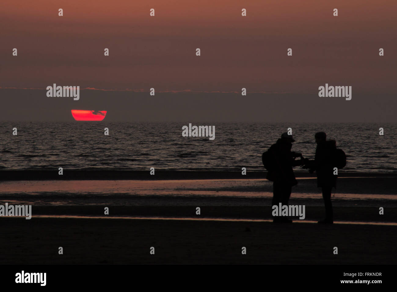 Members of the public enjoy the sunset, on Formby beach, Formby ...