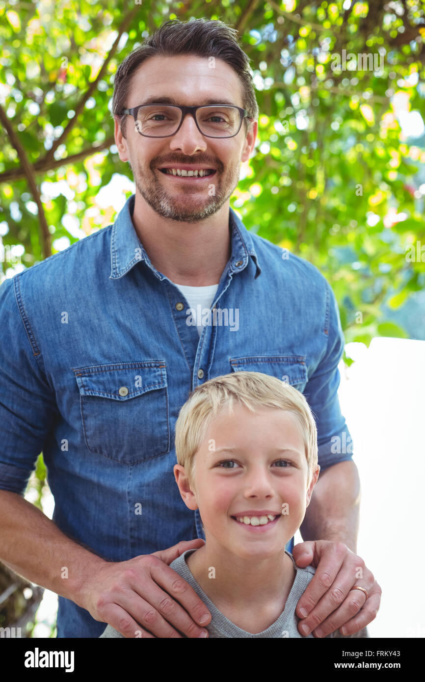Portrait of smiling father and son Stock Photo - Alamy