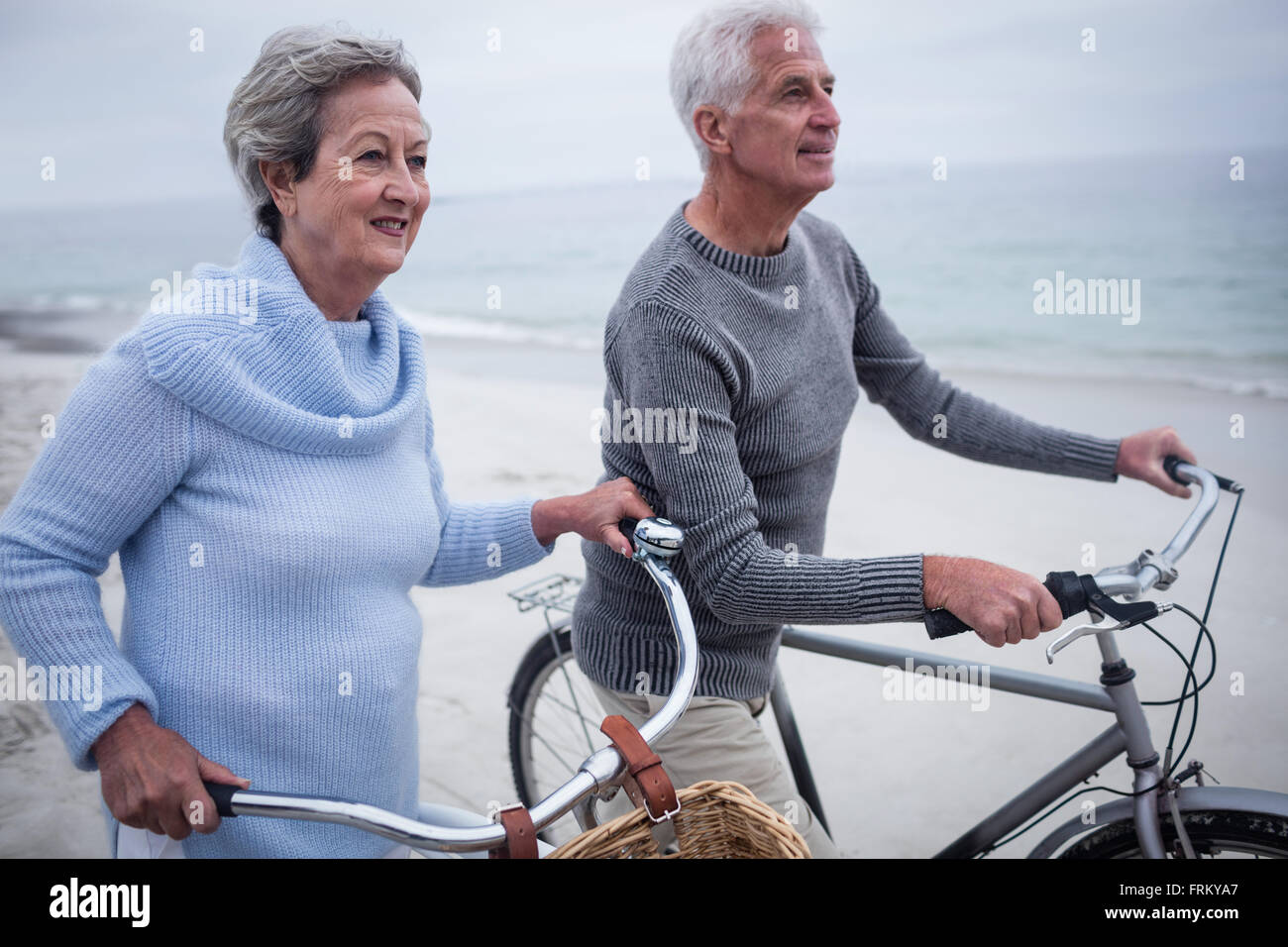 Senior couple having ride with their bike Stock Photo - Alamy