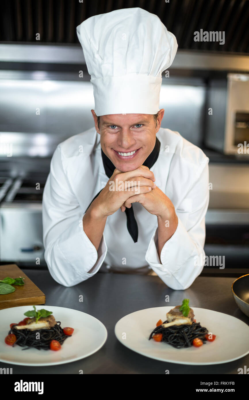 Portrait of happy chef in kitchen Stock Photo - Alamy