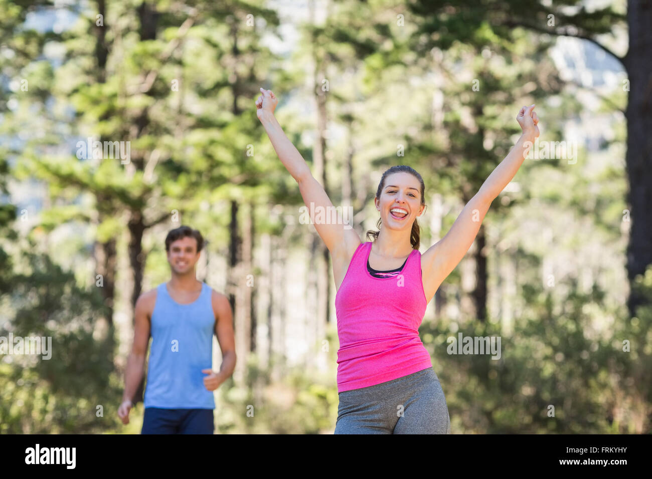 Woman standing raised arms hi-res stock photography and images - Alamy