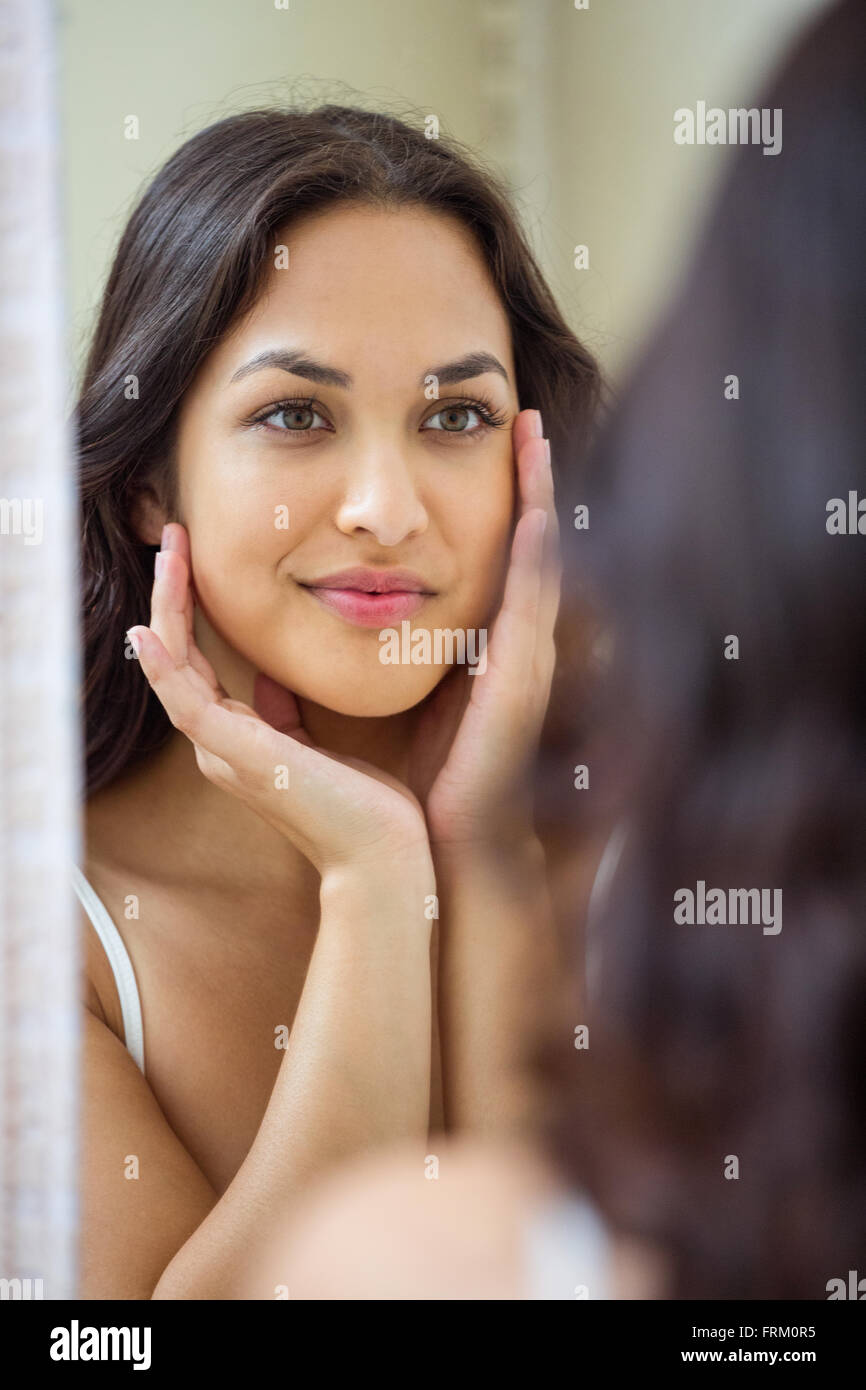 Woman looking in mirror hi-res stock photography and images - Alamy