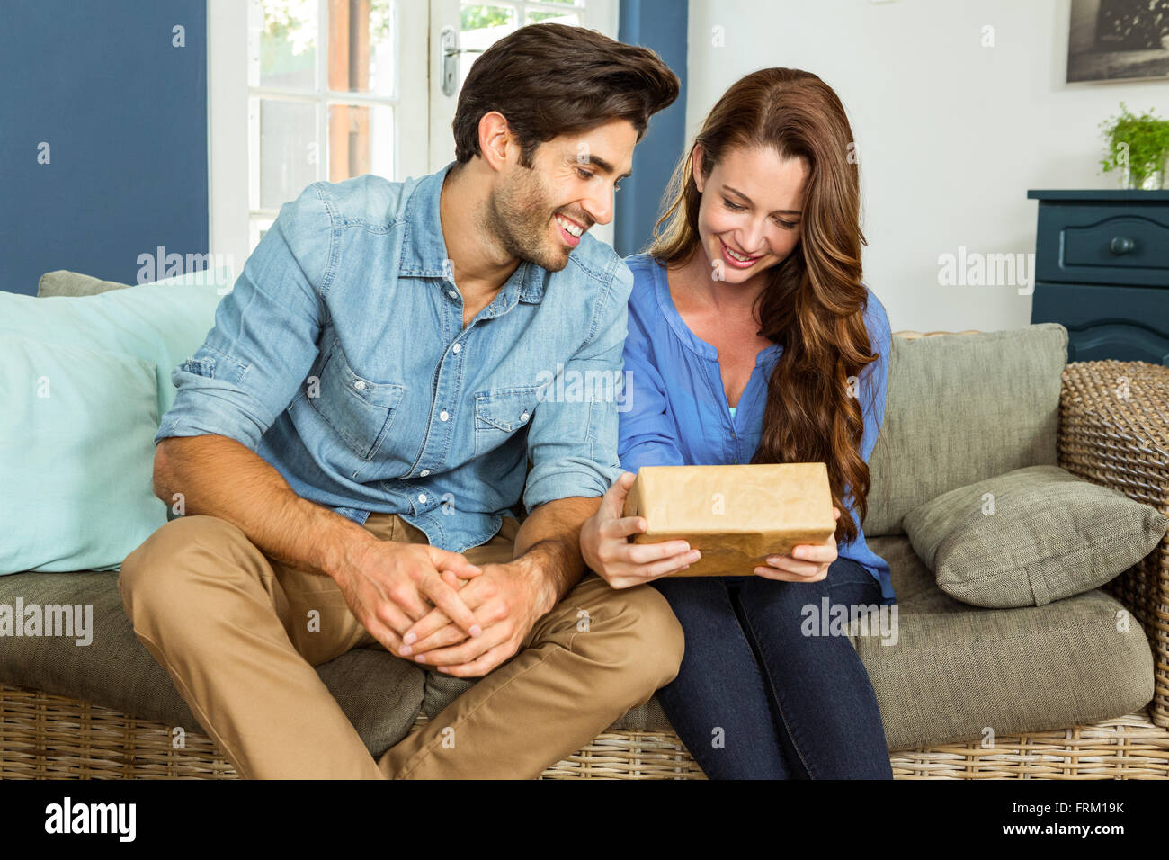 Man and woman sitting on a box hi-res stock photography and images - Alamy