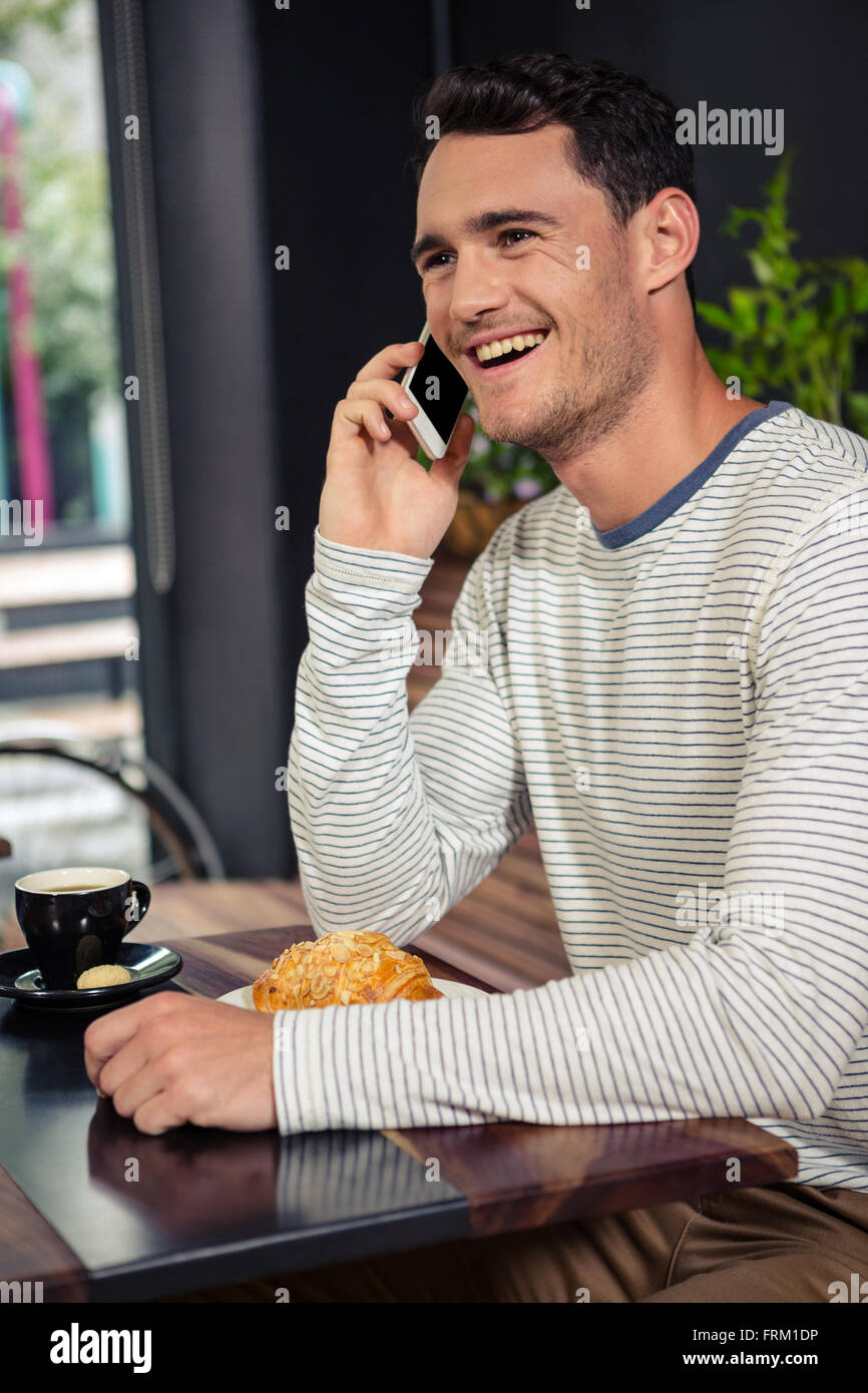 Happy man having a phone call Stock Photo - Alamy