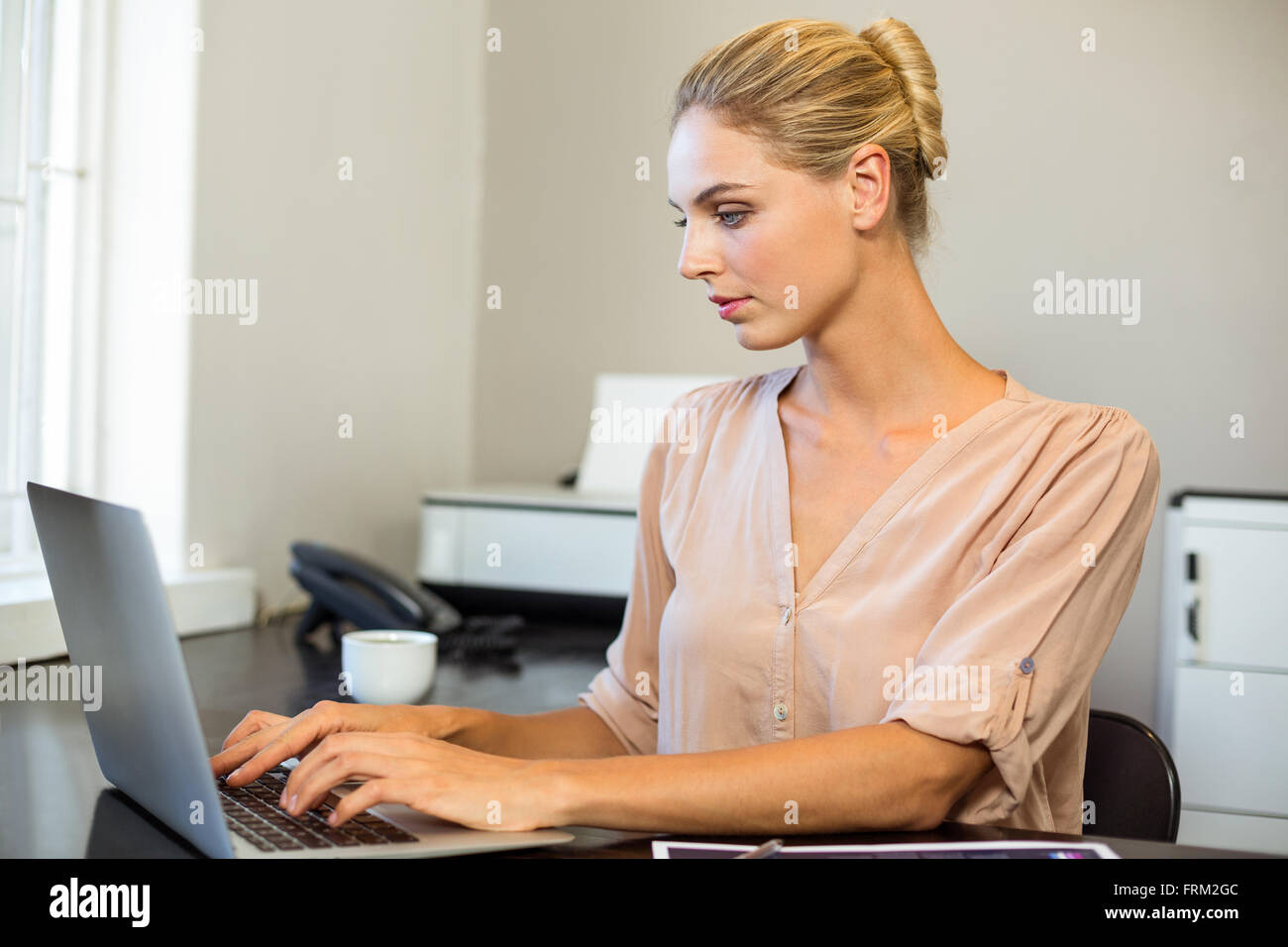 Woman working focused on laptop hi-res stock photography and images - Alamy