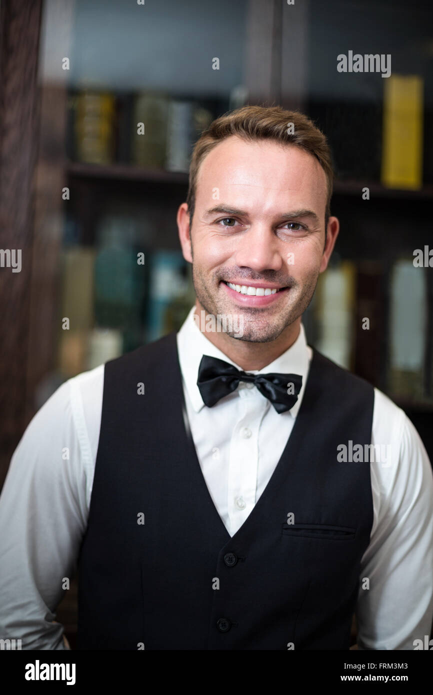 Portrait of smiling waiter Stock Photo - Alamy