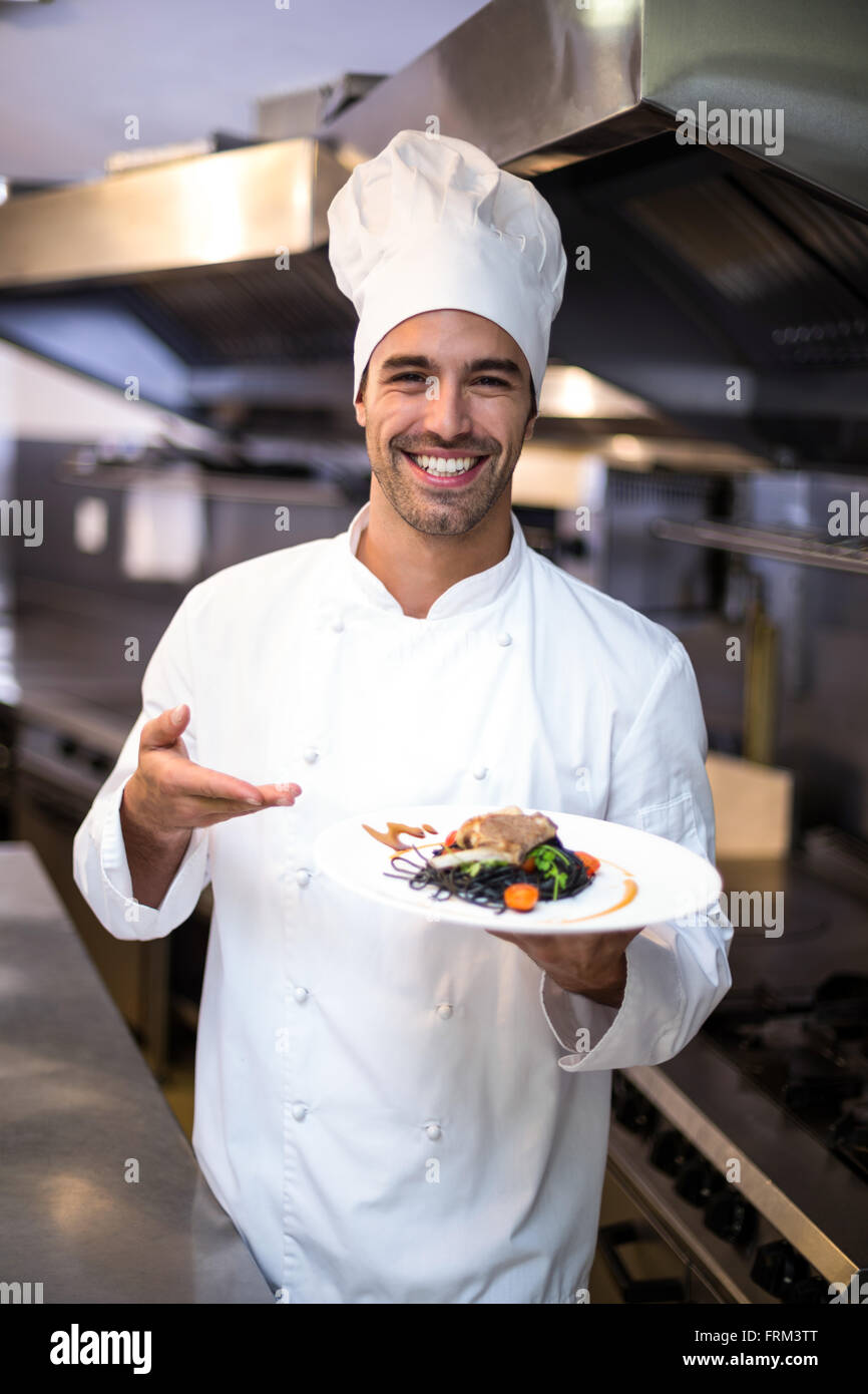 Handsome chef presenting meal hi-res stock photography and images - Alamy