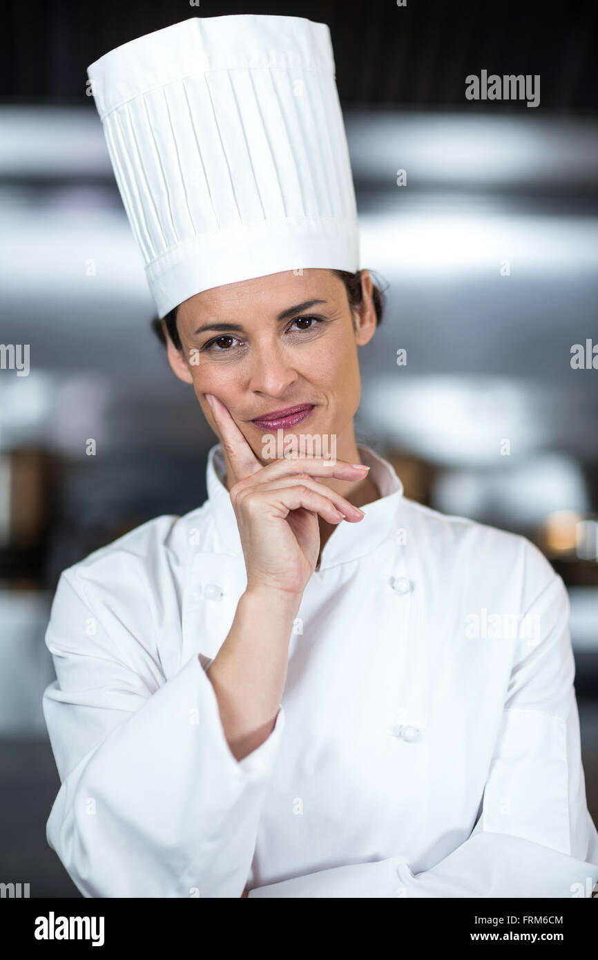 Portrait of female chef standing in kitchen Stock Photo - Alamy