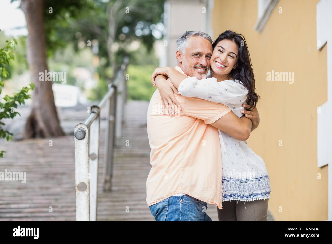 Hispanic couple embracing hi-res stock photography and images - Alamy
