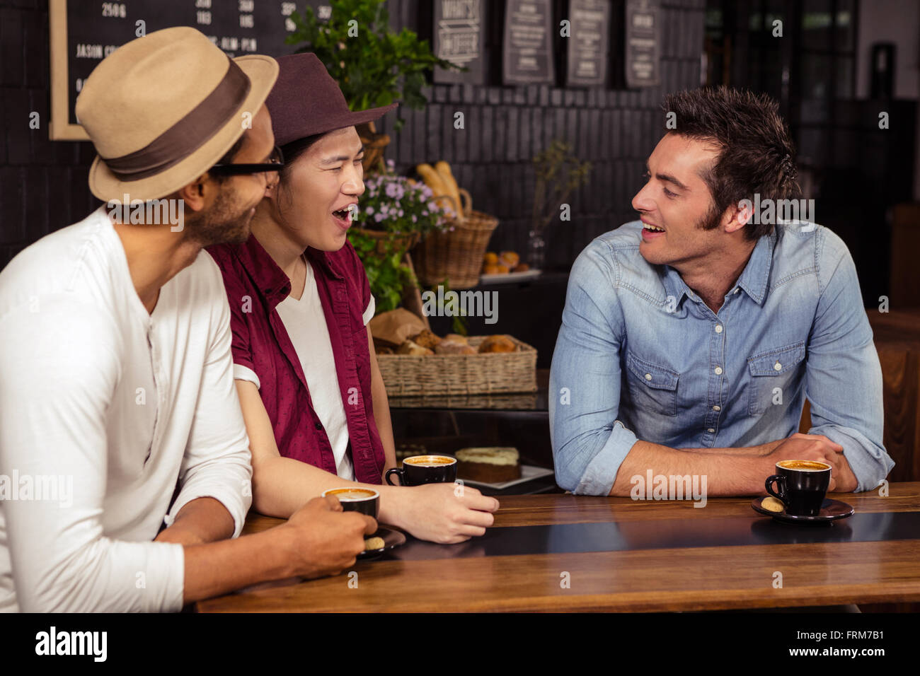 Smiling friends talking Stock Photo - Alamy