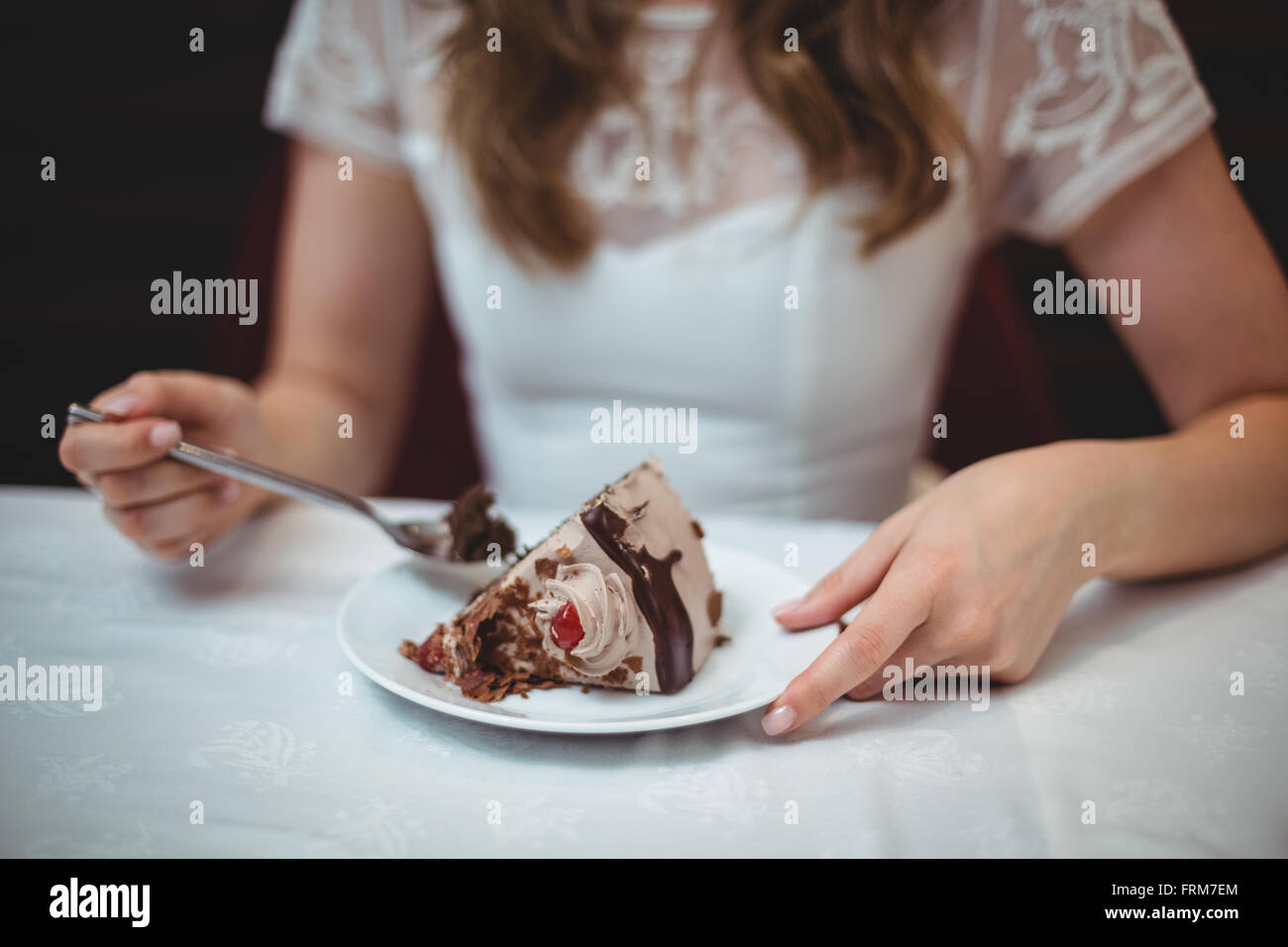 Midsection of woman with desert in plate Stock Photo - Alamy