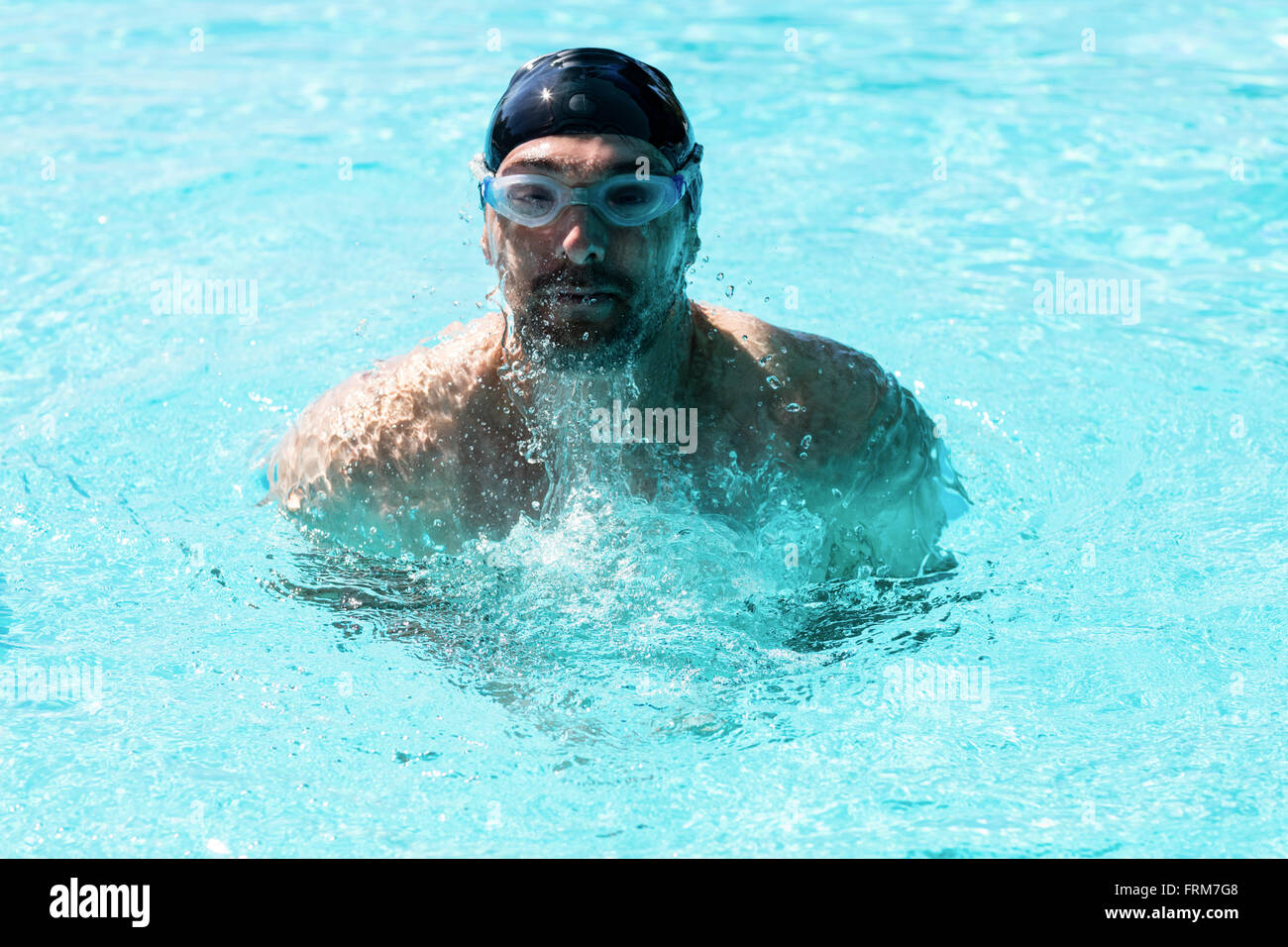 Fit swimmer doing the butterfly stroke Stock Photo - Alamy