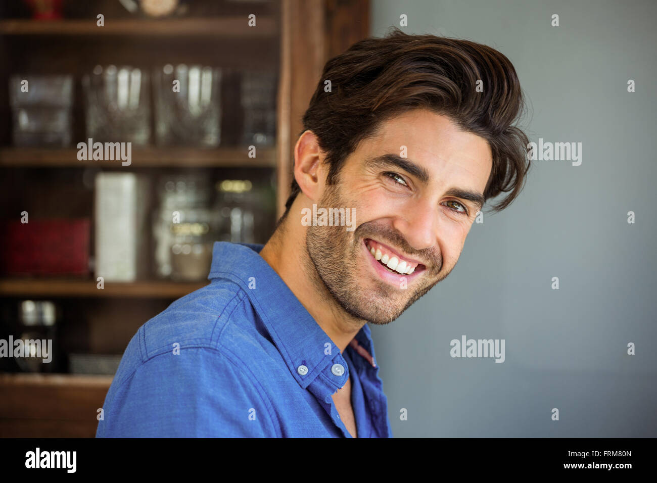 Portrait of young man smiling Stock Photo - Alamy