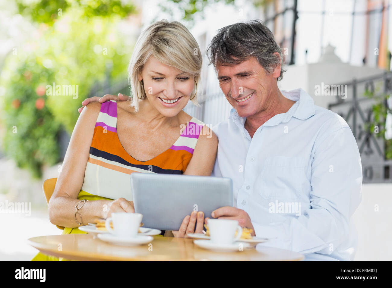 Happy romantic couple computer tablet hi-res stock photography and ...