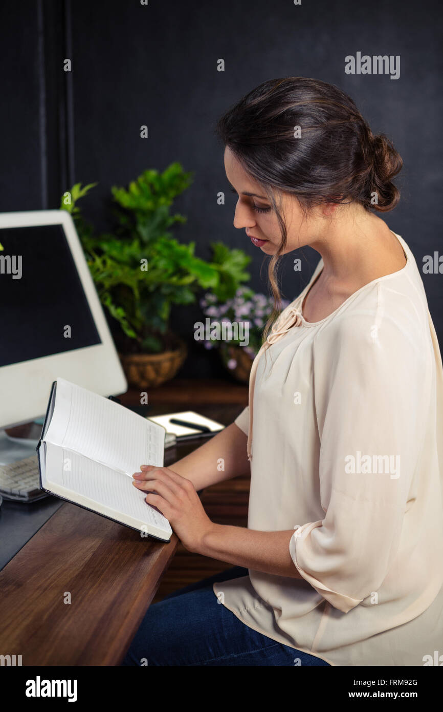 Woman reading files desk hi-res stock photography and images - Alamy