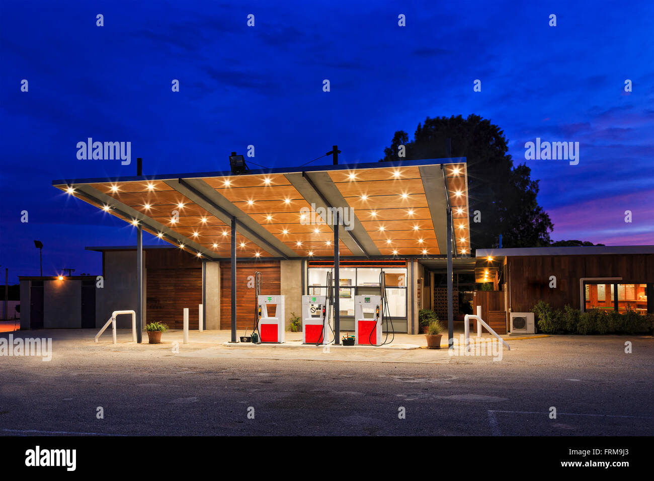 illuminated remote fuel station in Western Australia at sunset with ...