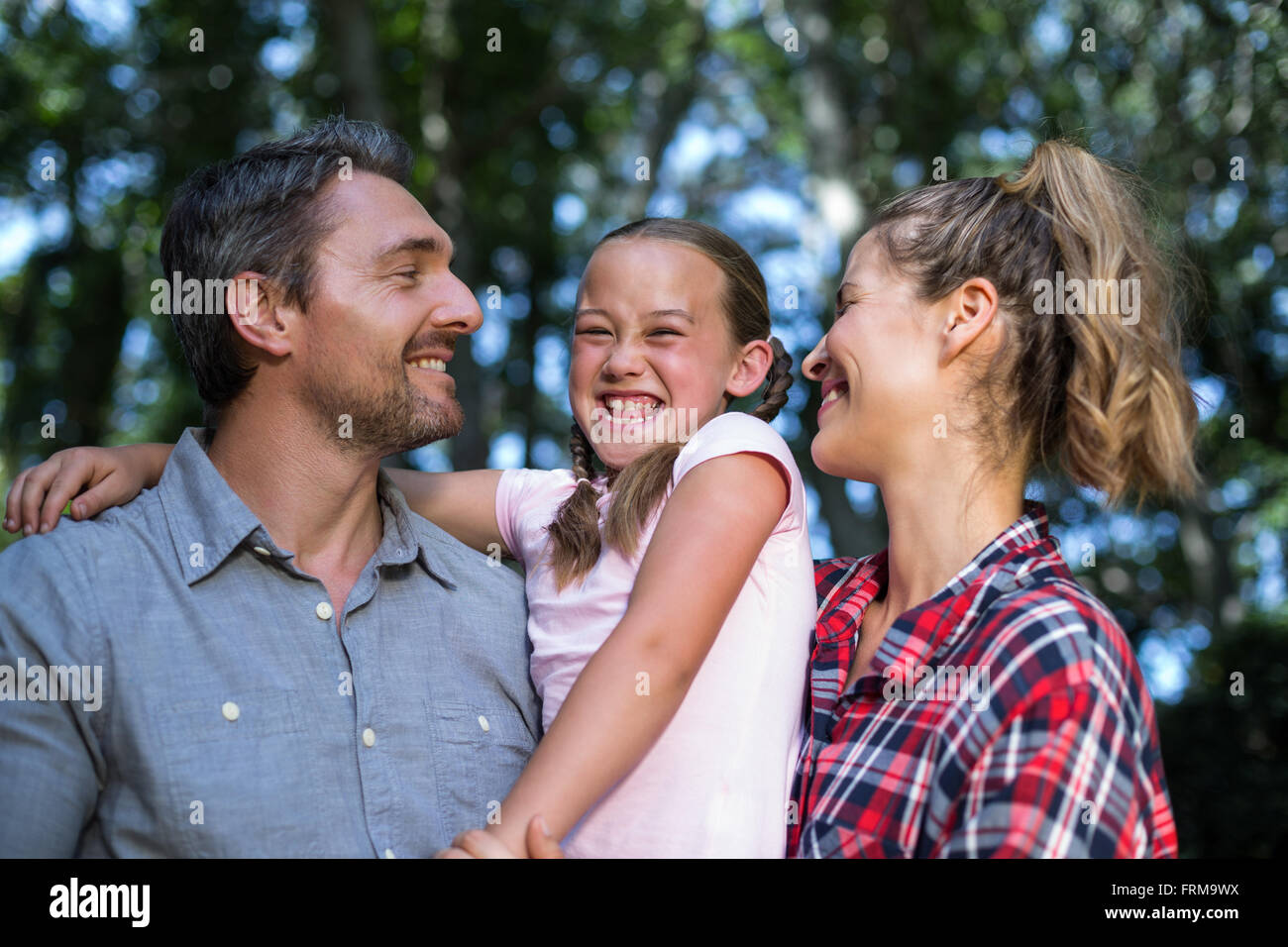 Laughing daughter with parents Stock Photo - Alamy