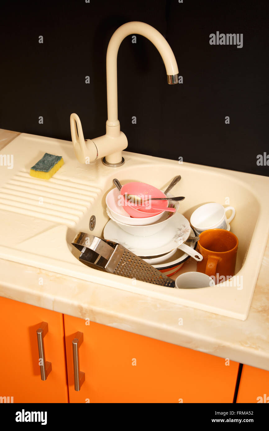 Dirty dishes in kitchen sink in closeup Stock Photo - Alamy