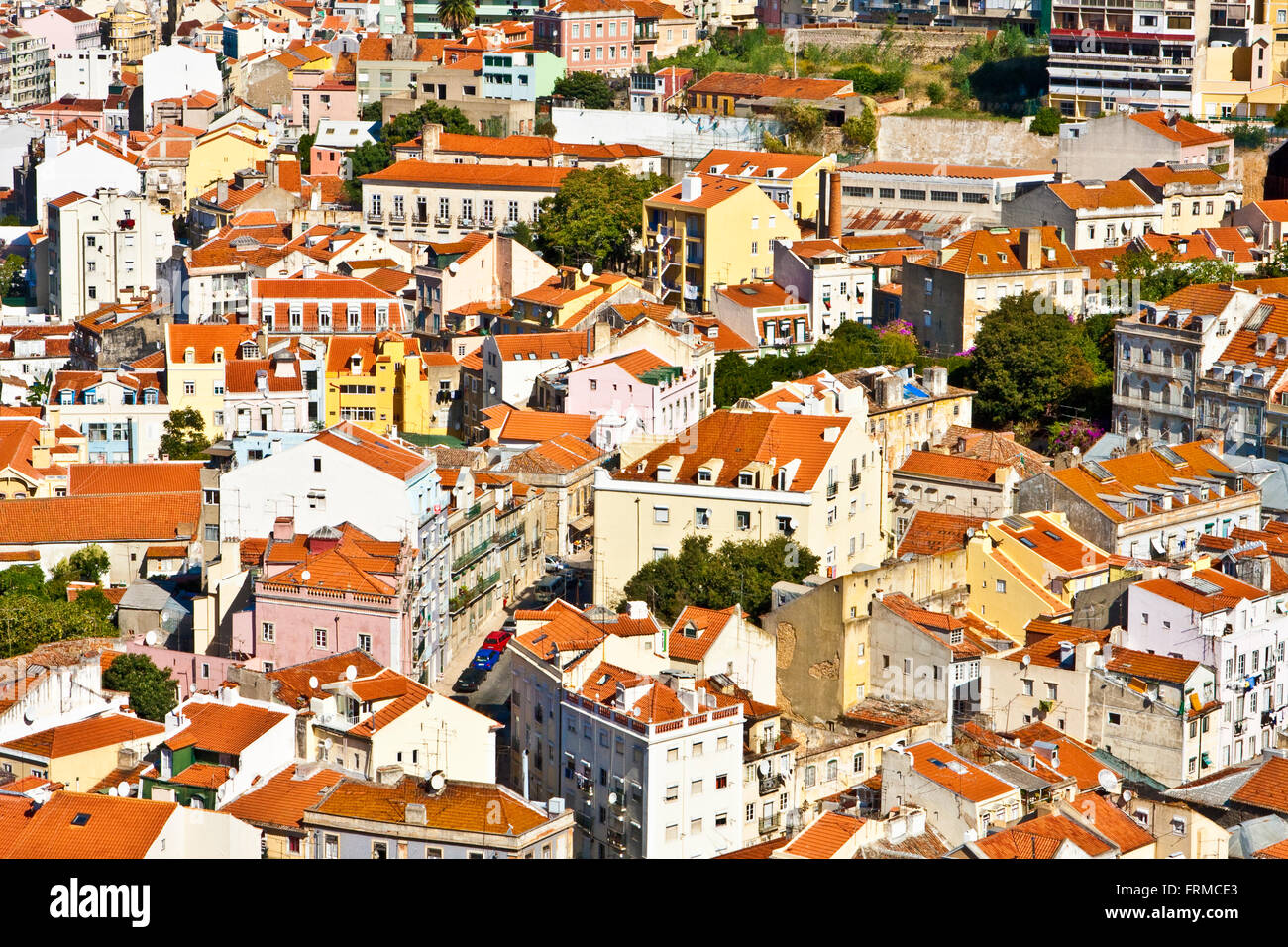 Compressed, aerial view of white buildings with clay tile roofs in ...