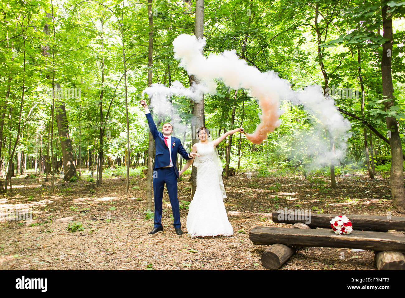 Funny bride and groom outdoors. Happy wedding day Stock Photo - Alamy