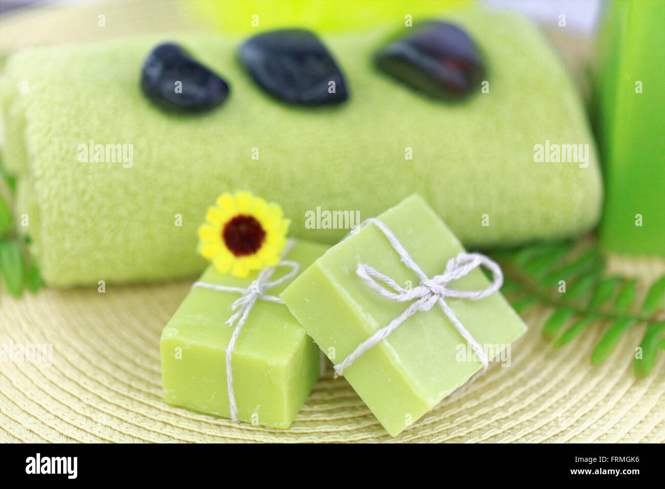 Spa treatment setting with green theme Stock Photo - Alamy