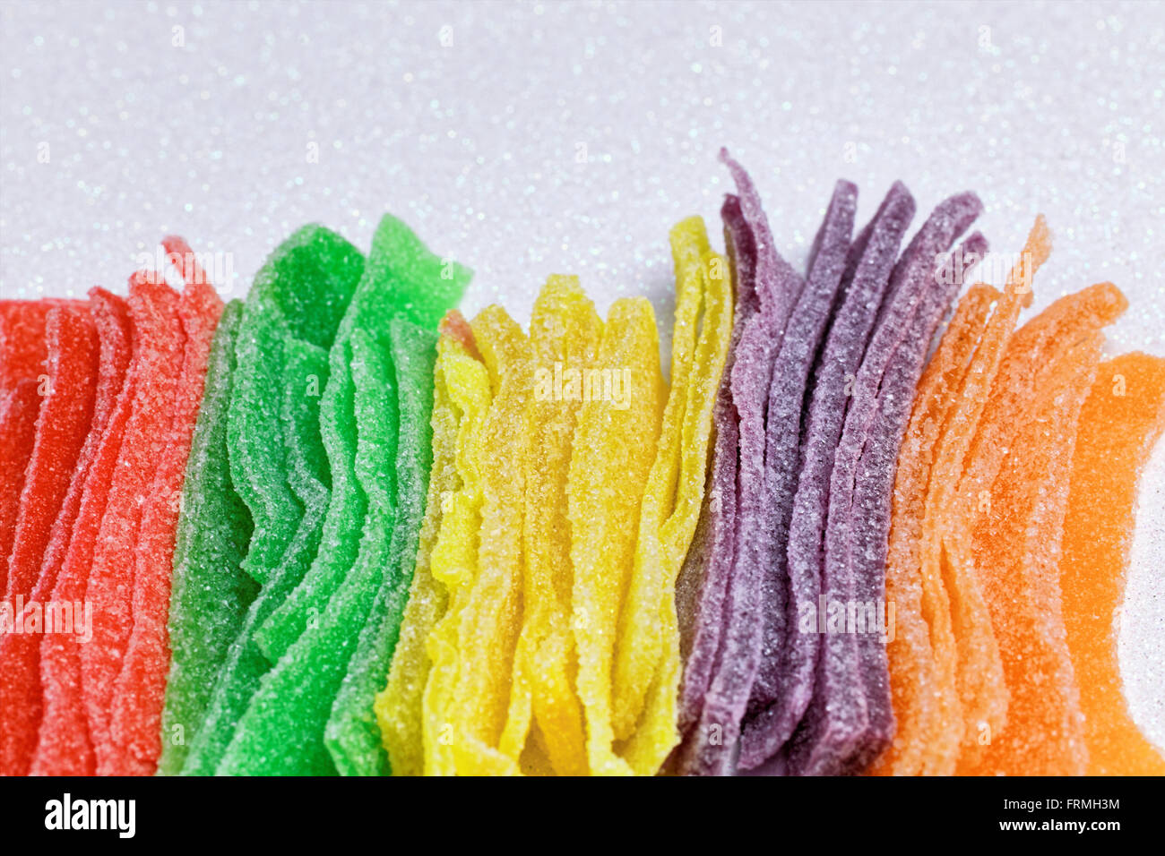 Colorful sugar jelly candy strip over white background Stock Photo - Alamy
