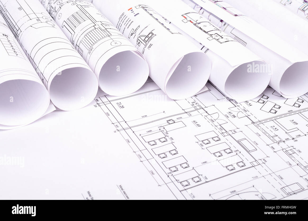 Architecture plan and rolls of blueprints Stock Photo - Alamy