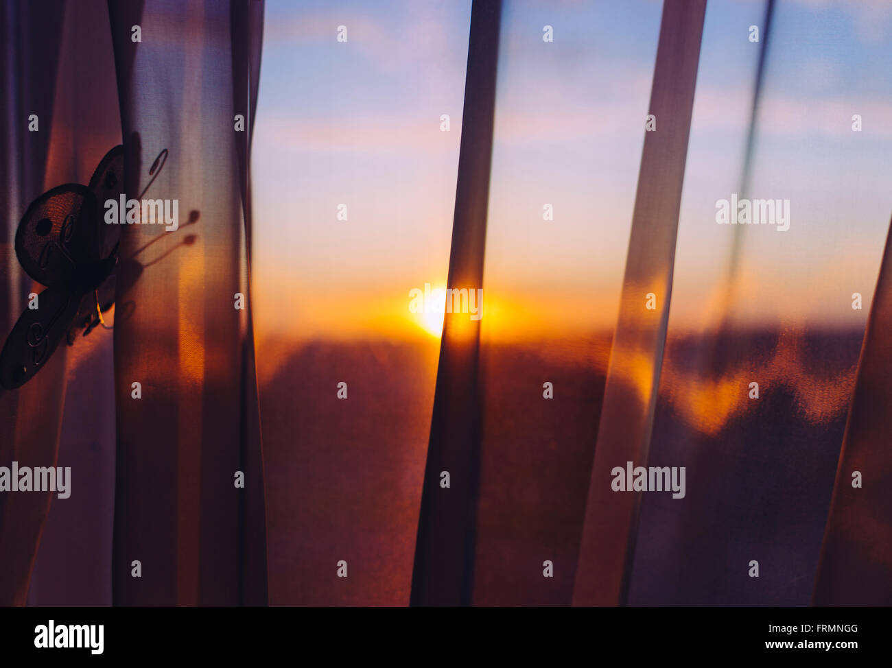 Beautiful sun shining through curtain with butterfly Stock Photo - Alamy