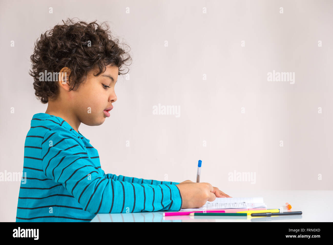 Boy doing homework Stock Photo - Alamy