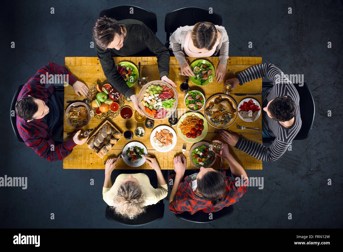 Top view of friends at table with food Stock Photo - Alamy